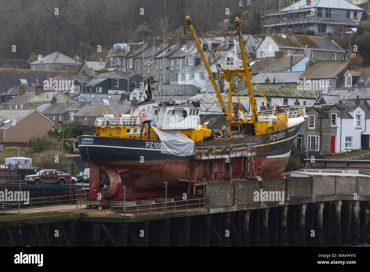 a fishing boat or trawler used for fishing in the port of newlyn in ...