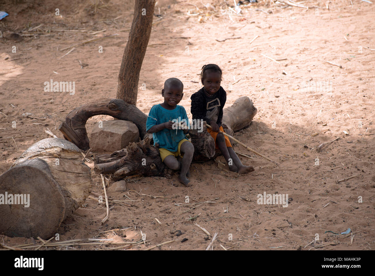 Indigenous Dogon tribe children playing while taking shelter from the ...