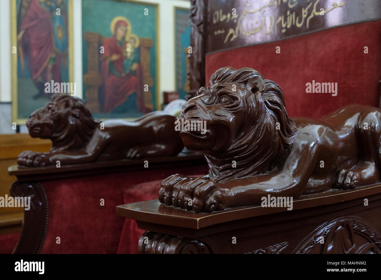 Carved wooden lions decorating the cathedra or bishop's throne in which ...