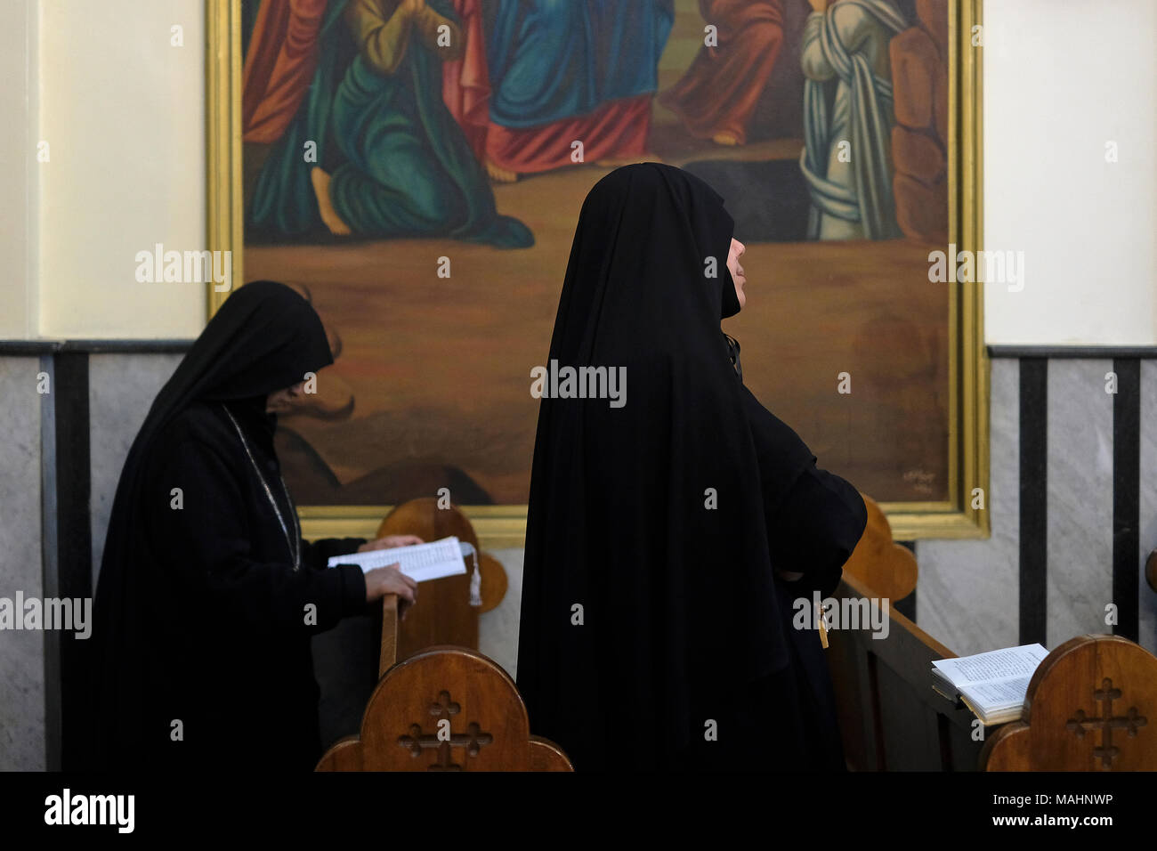 Coptic nuns taking part in the evening Bascha ( Passover) prayer of the ...