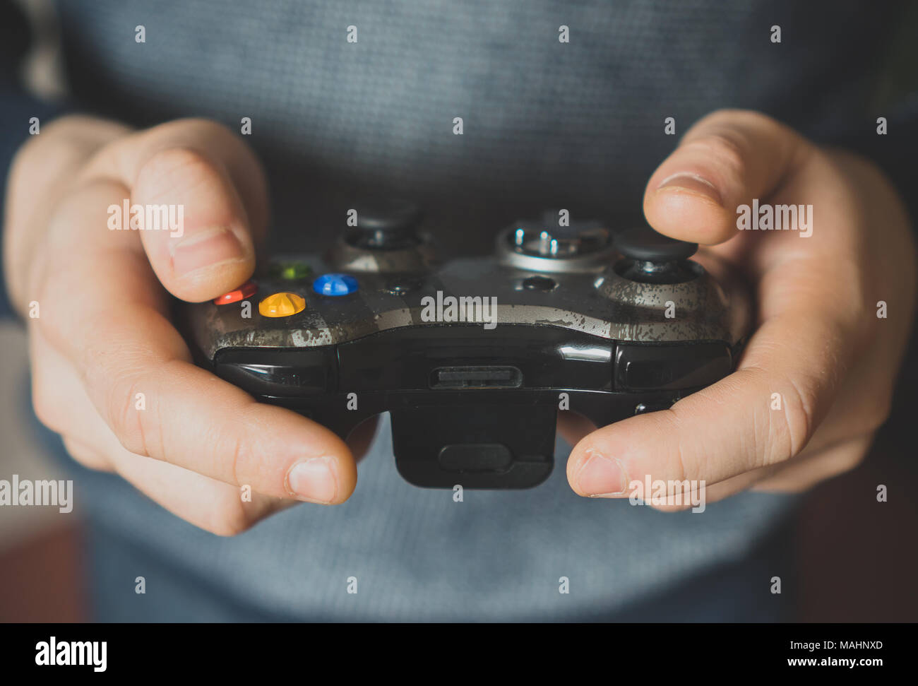 Man playing computer games with a joystick Stock Photo - Alamy