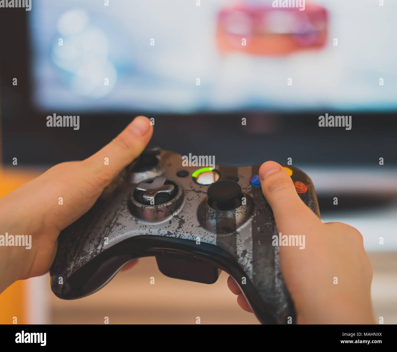 Child playing computer games with a joystick Stock Photo - Alamy