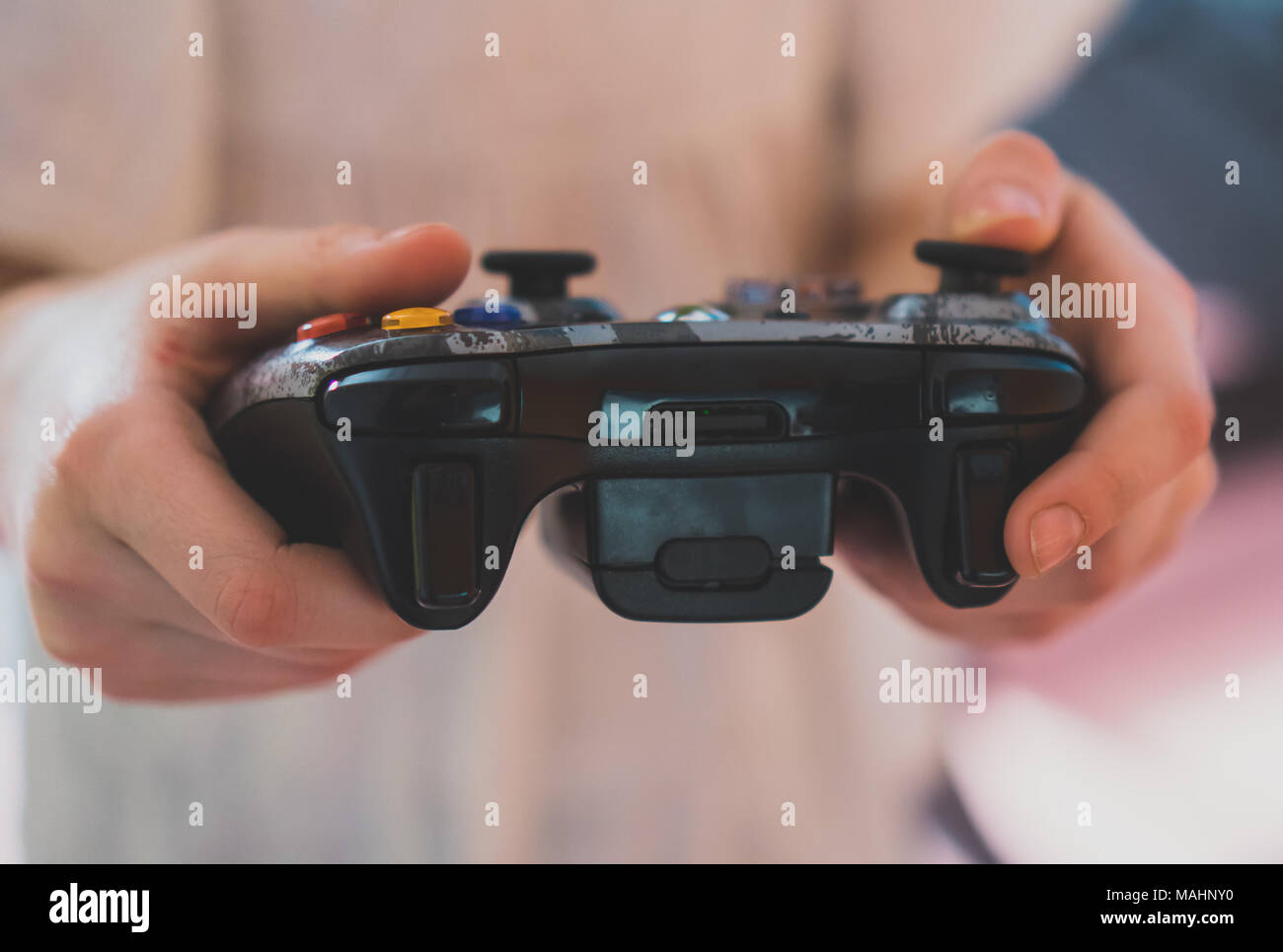 Child playing computer games with a joystick Stock Photo - Alamy
