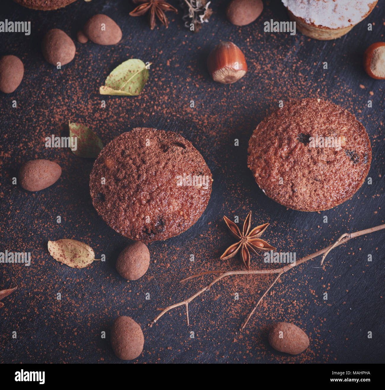 baked round muffins with a raisin black wooden table, top view Stock ...