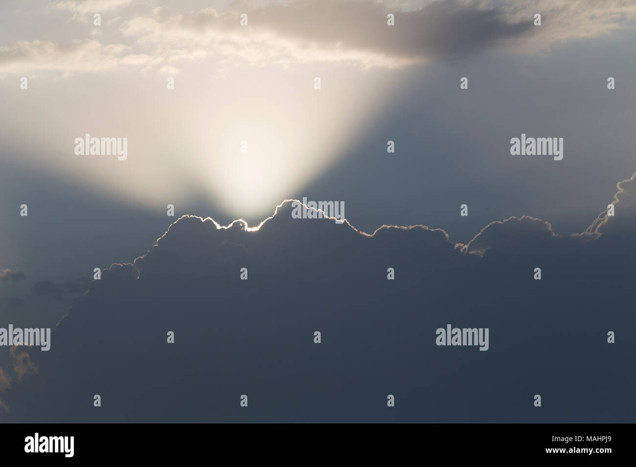 Cyprus, crepuscular rays of light causing dramatic shadows in the sky ...