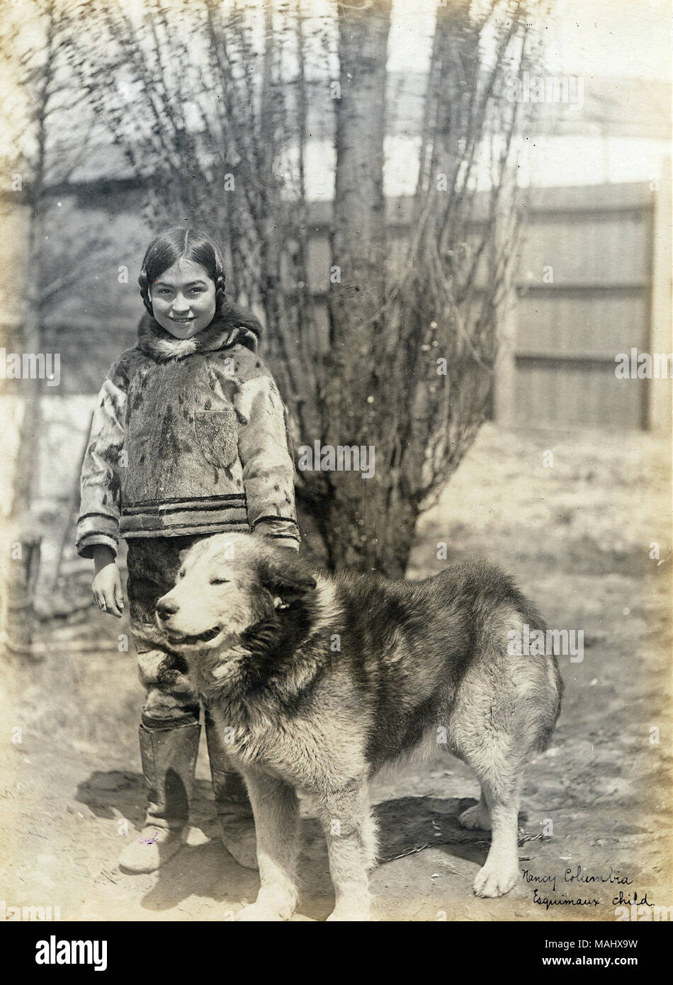 Title: 'Nancy Columbia, Esquimaux child' (with dog) at the 1904 World's ...