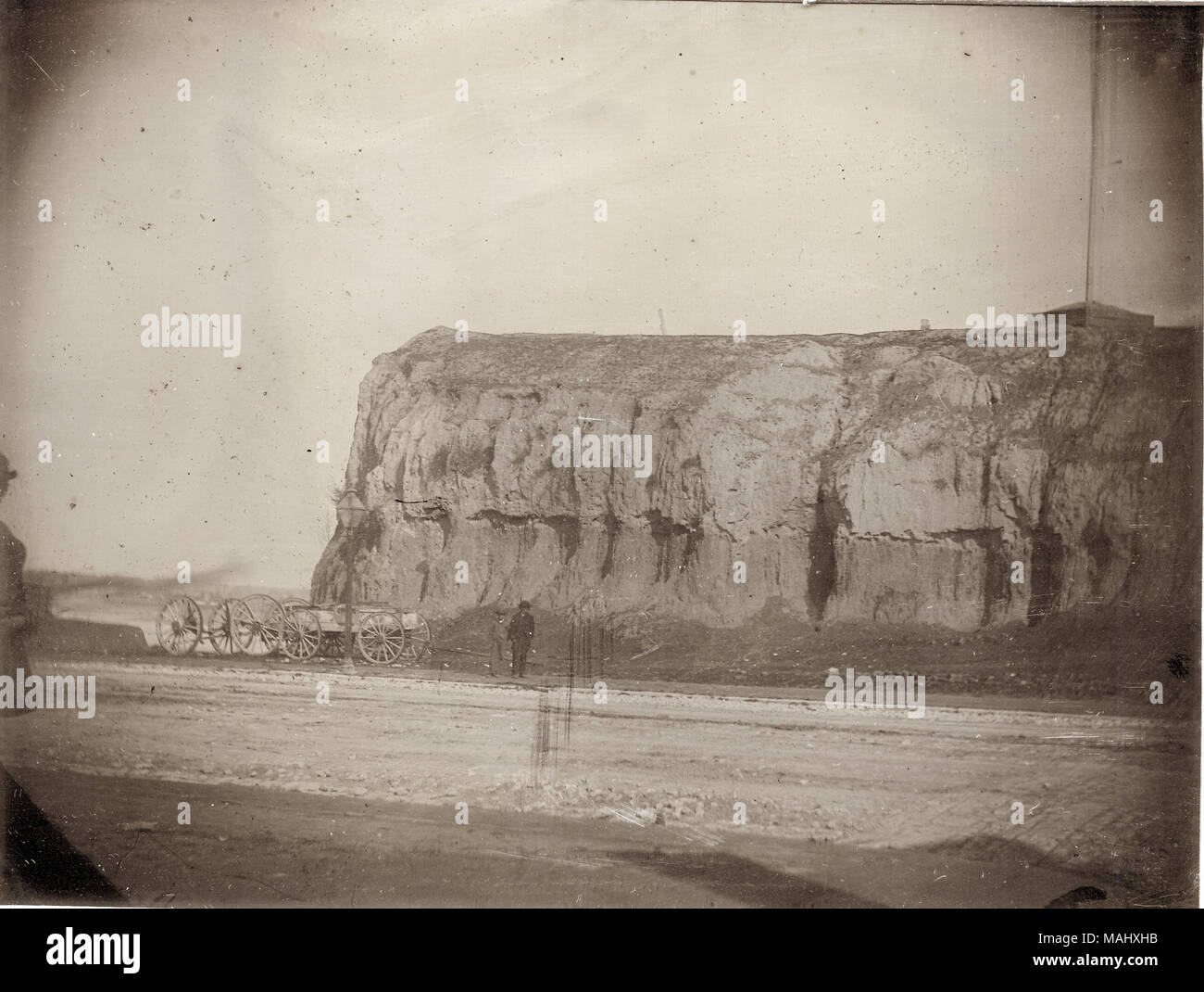 A young man stands in the foreground and two stand in front of the Big ...