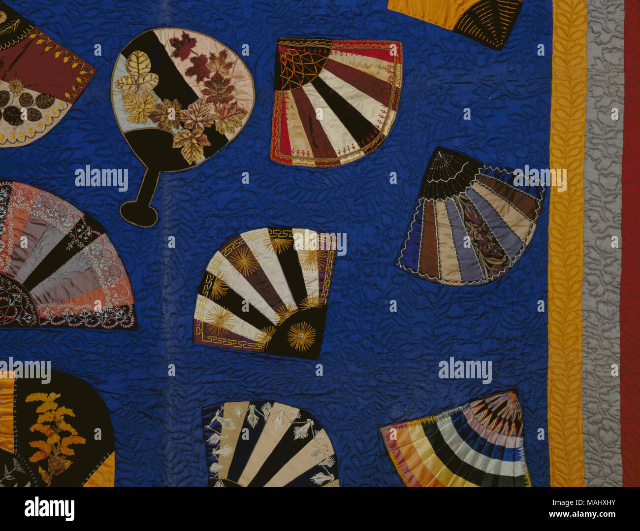 Blue silk applique quilt with fan motif throughout. Title: Silk ...