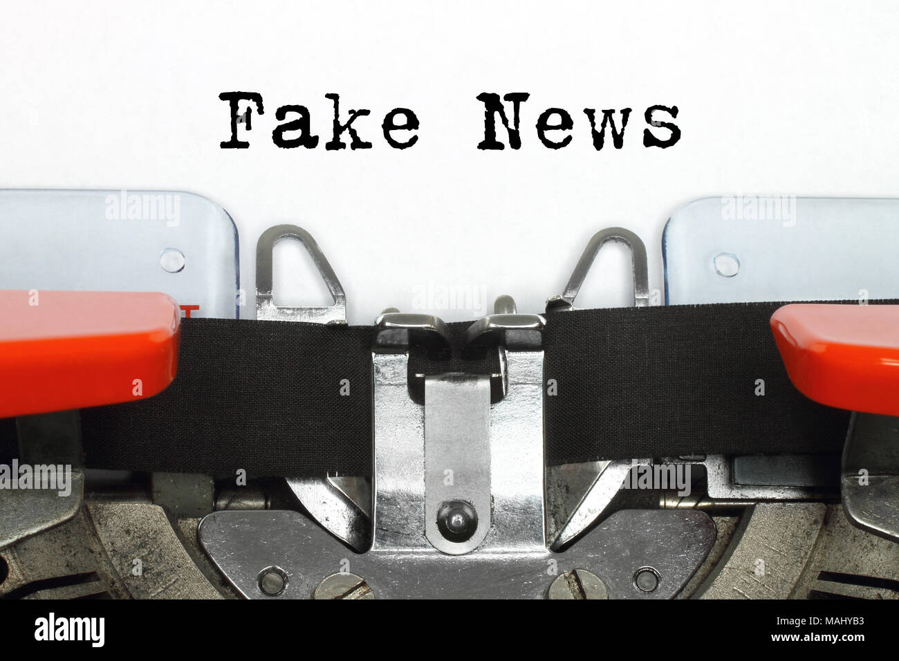 Part of typing machine with typed Fake News words close-up Stock Photo ...