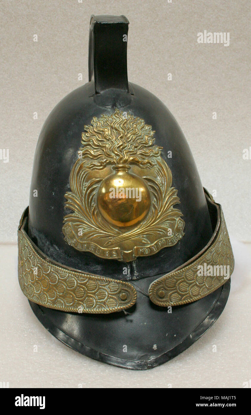 Black French fireman's helmet with brass d+?cor including comb and ...
