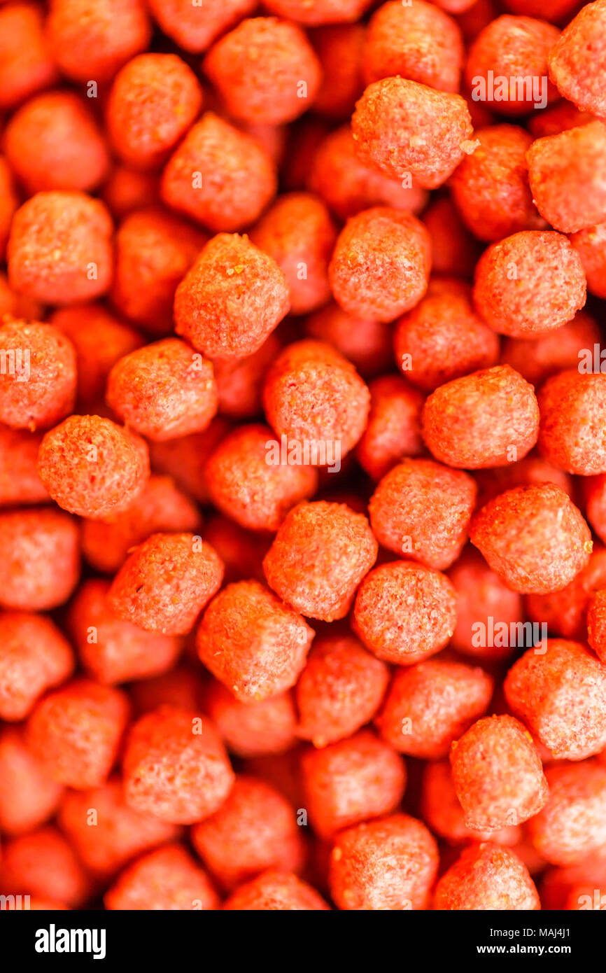 close up Berry flavor suet pellets used as bird food Stock Photo - Alamy