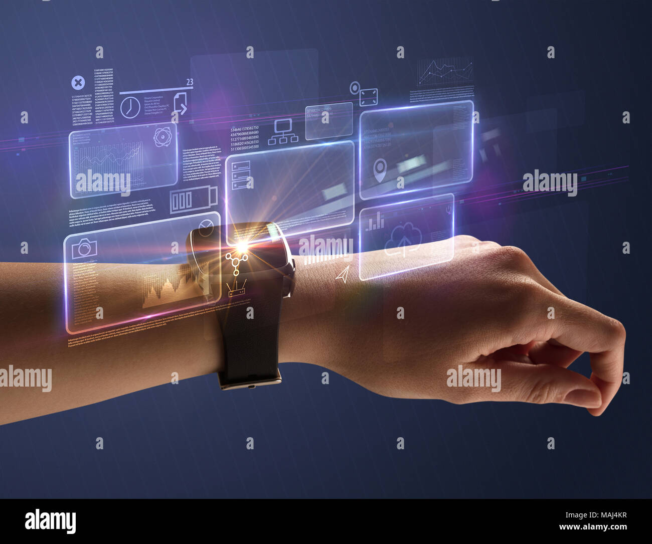 Female hand wearing smartwatch with statement labels around and dark ...