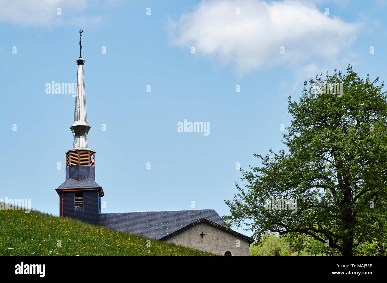Belfry of a stone church in the French Savoie Stock Photo - Alamy