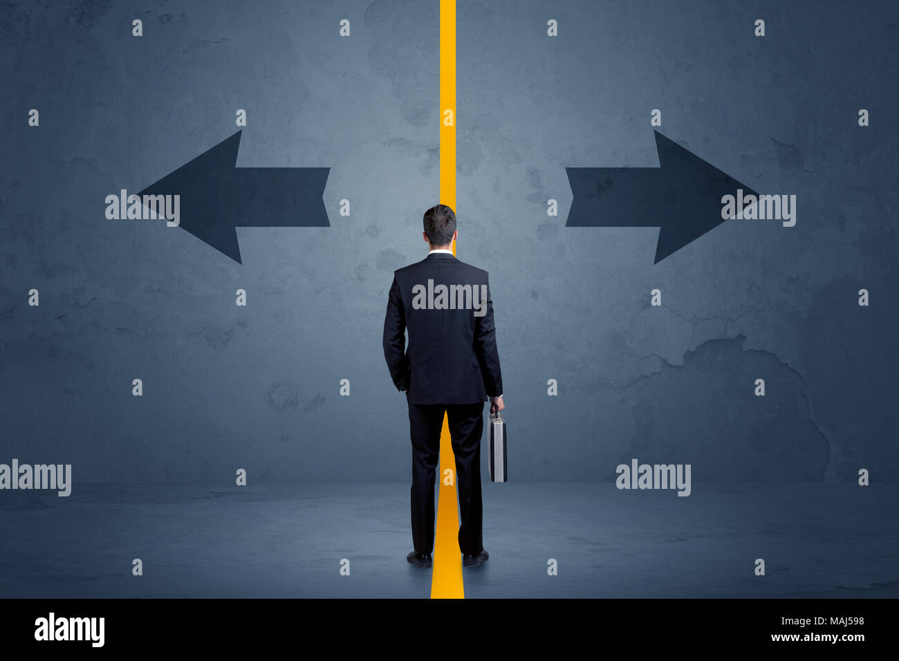 Business person choosing between two options separated by a yellow ...