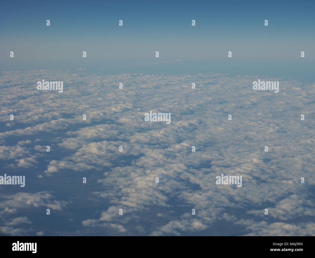 Scenic panorama of blue sky and cloud as seen through window of an ...