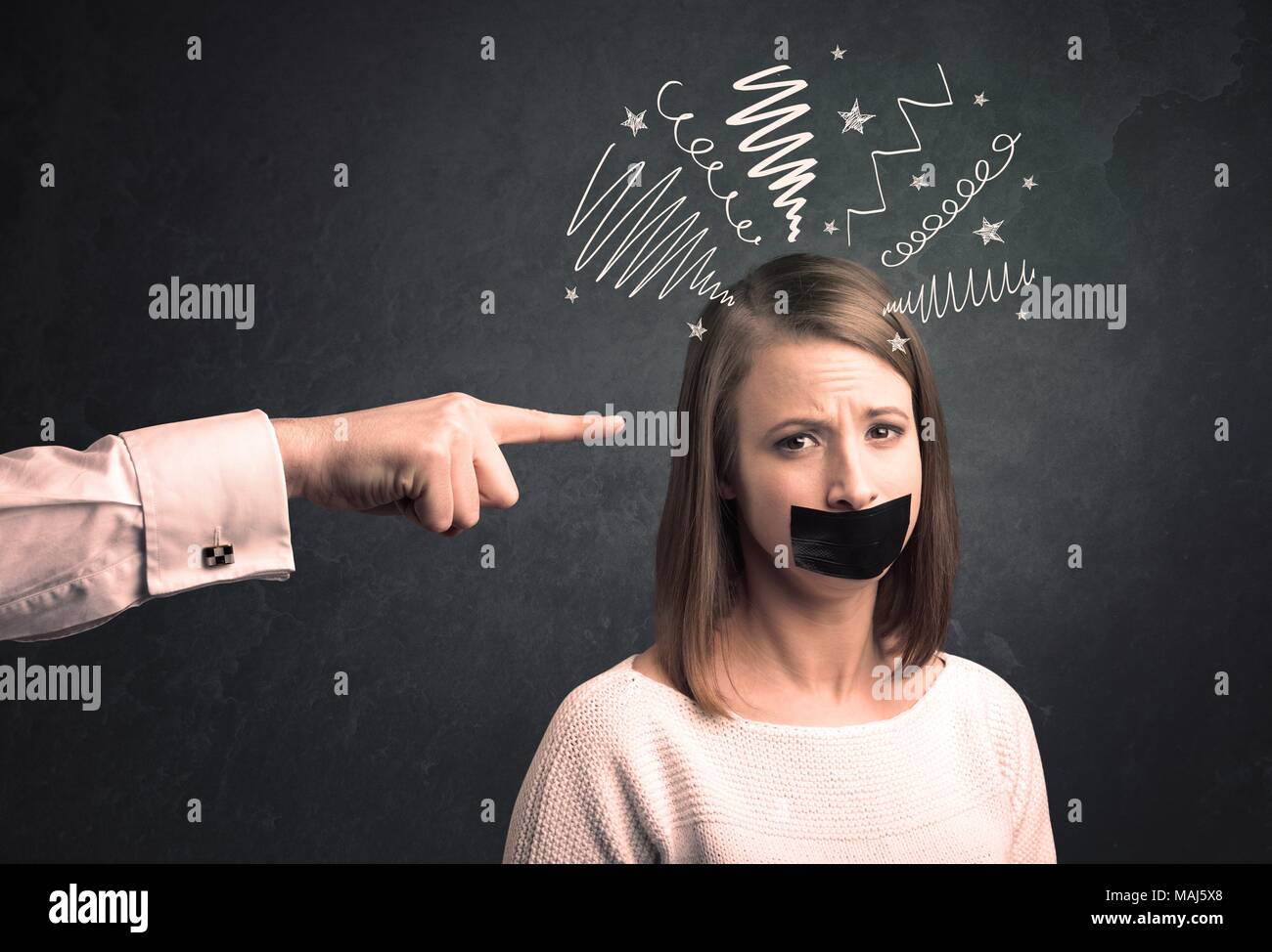 Caucasian hand pointing at scared female employee Stock Photo - Alamy