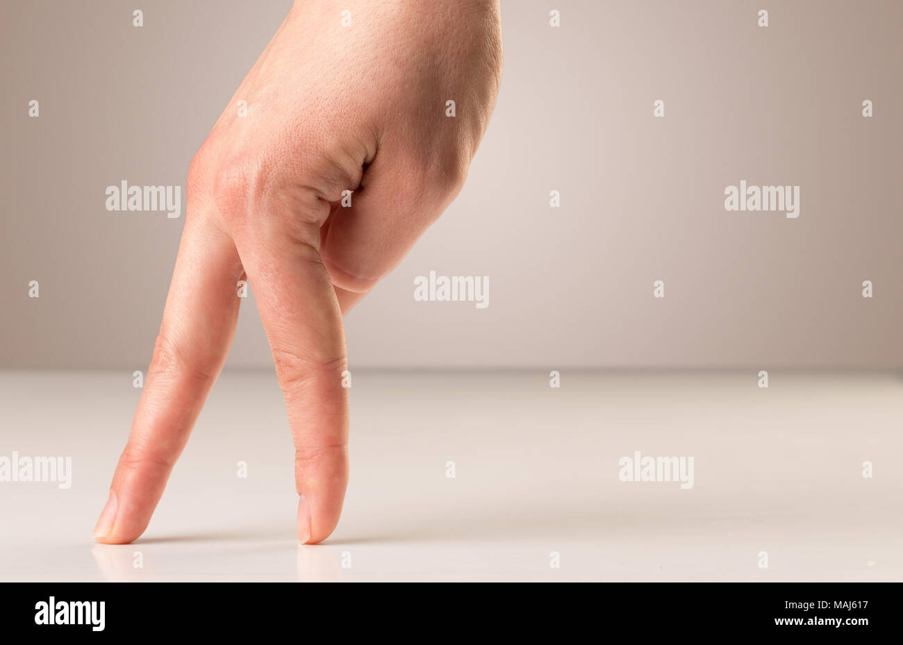 Female fingers walking on white surface Stock Photo - Alamy