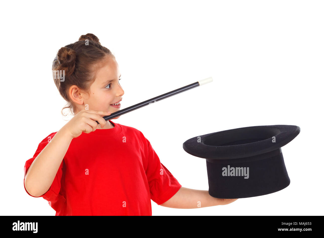 Pretty little girl doing magic with a top hat and a magic wand isolated ...