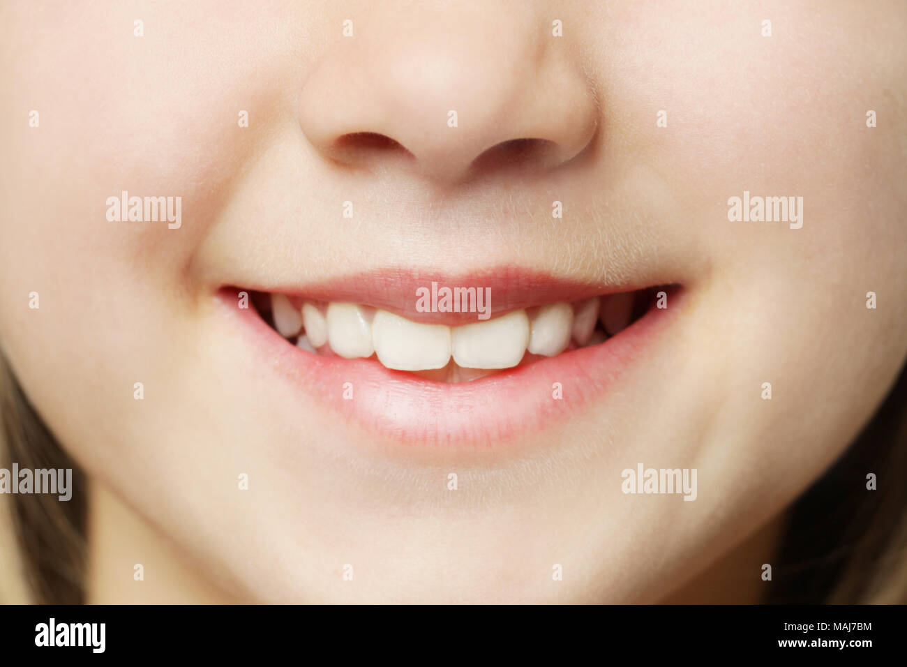 Toothy smile - lips and teeth, macro Stock Photo - Alamy