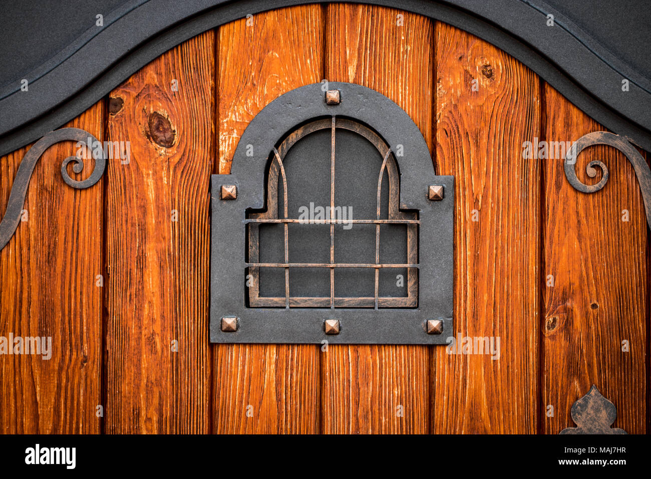 wooden gate with wrought iron elements close up Stock Photo - Alamy