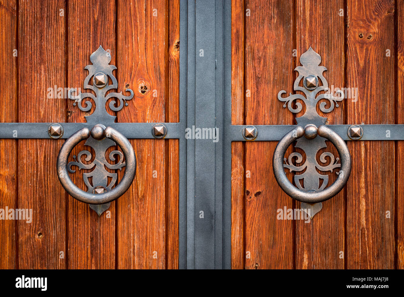 wooden gate with wrought iron elements close up Stock Photo - Alamy