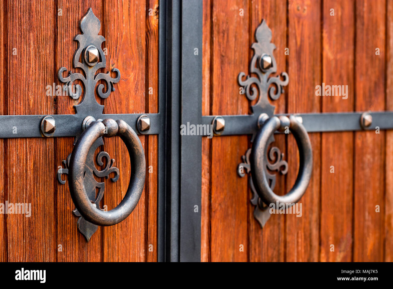 wooden gate with wrought iron elements close up Stock Photo - Alamy