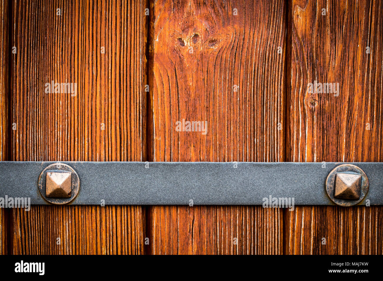 wooden gate with wrought iron elements close up Stock Photo - Alamy