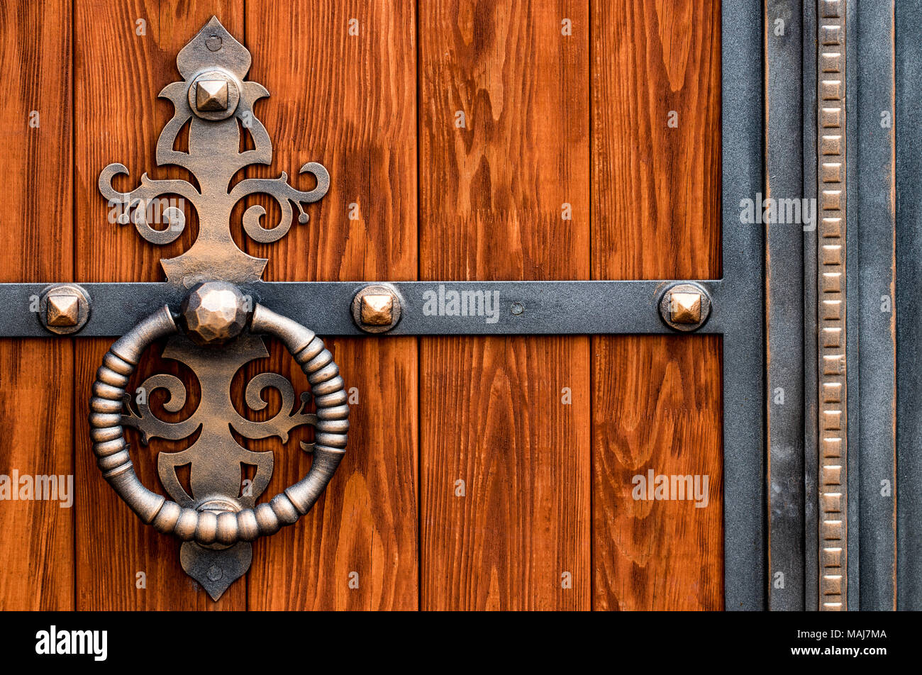 wooden gate with wrought iron elements close up Stock Photo - Alamy