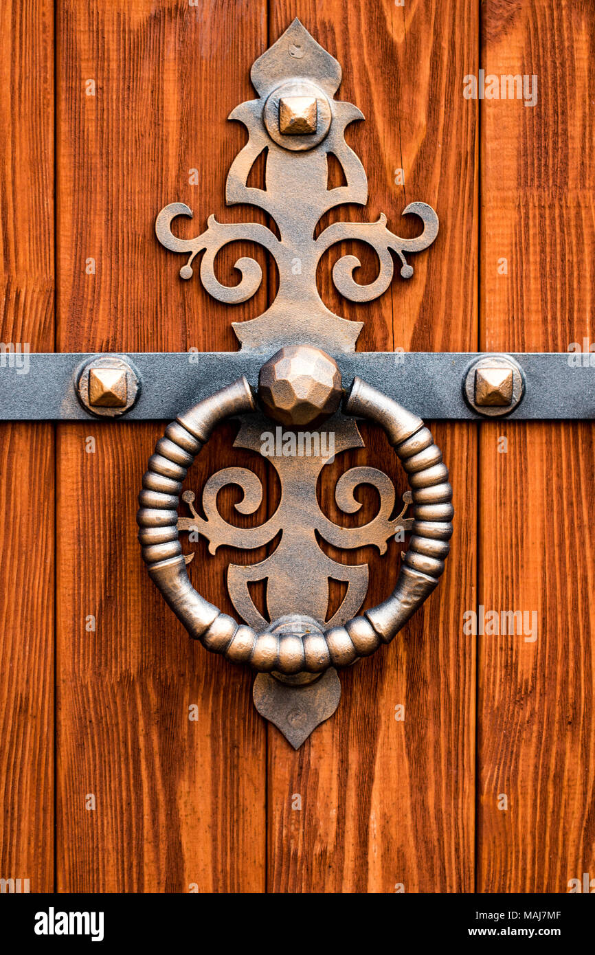 wooden gate with wrought iron elements close up Stock Photo - Alamy