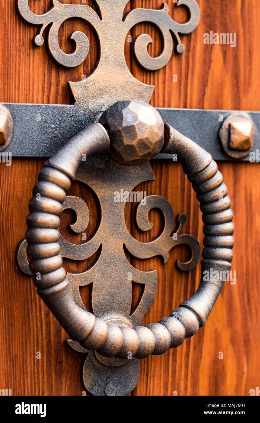 wooden gate with wrought iron elements close up Stock Photo - Alamy