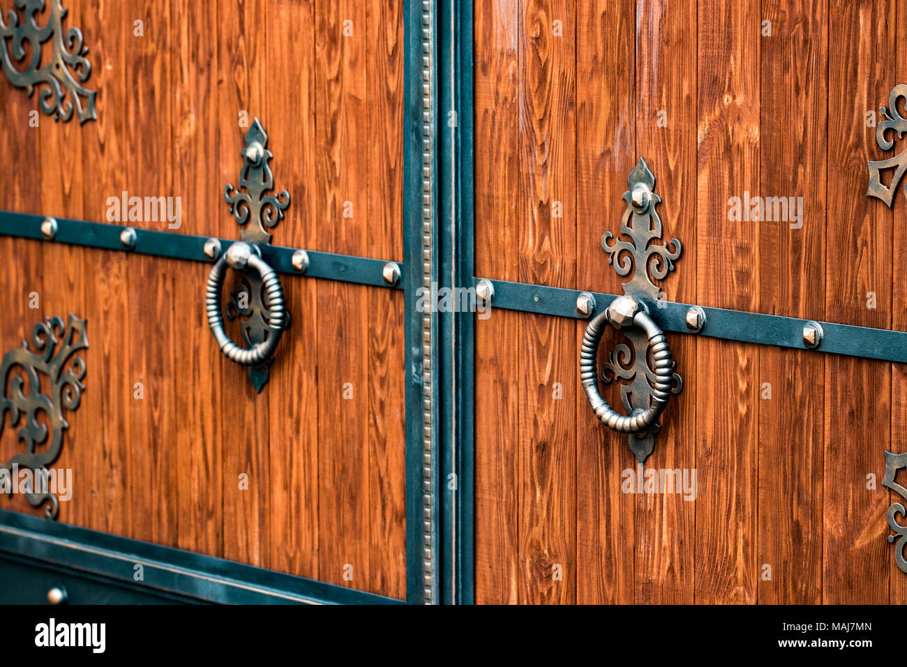 wooden gate with wrought iron elements close up Stock Photo - Alamy