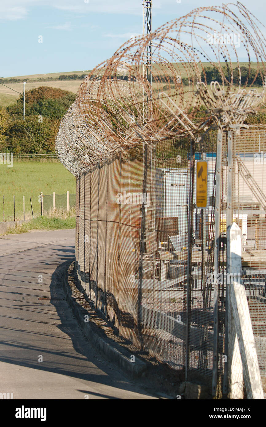 Razor wire fence protecting a secure facility Stock Photo - Alamy