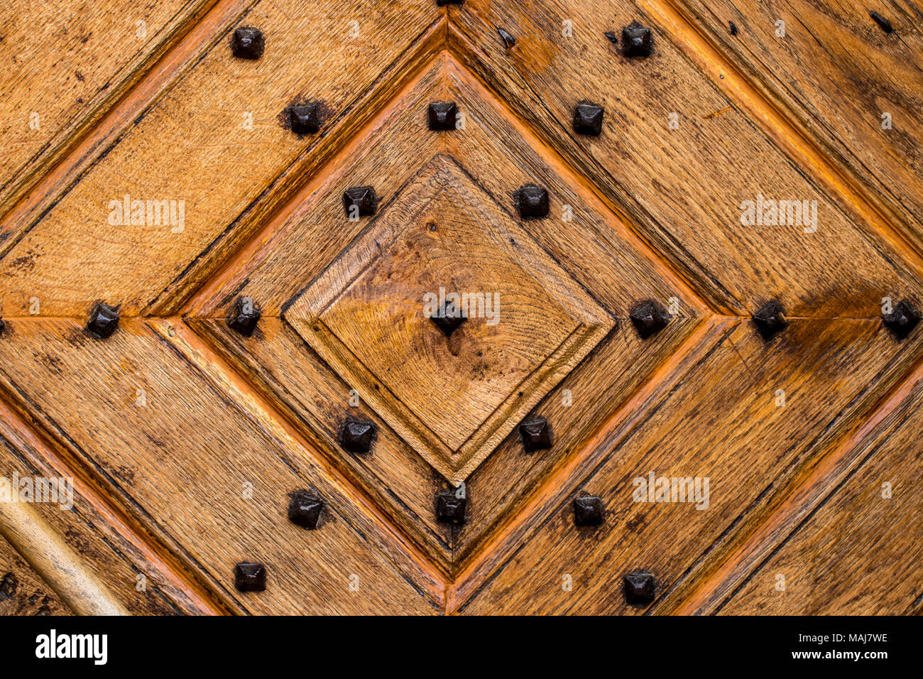 wooden gate with wrought iron elements close up Stock Photo - Alamy
