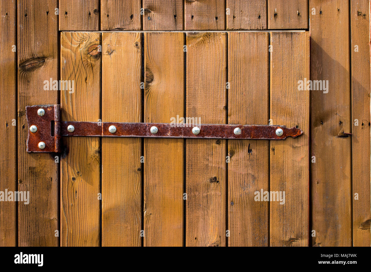 wooden gate with wrought iron elements close up Stock Photo - Alamy