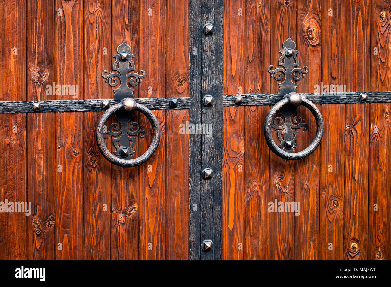 wooden gate with wrought iron elements close up Stock Photo - Alamy