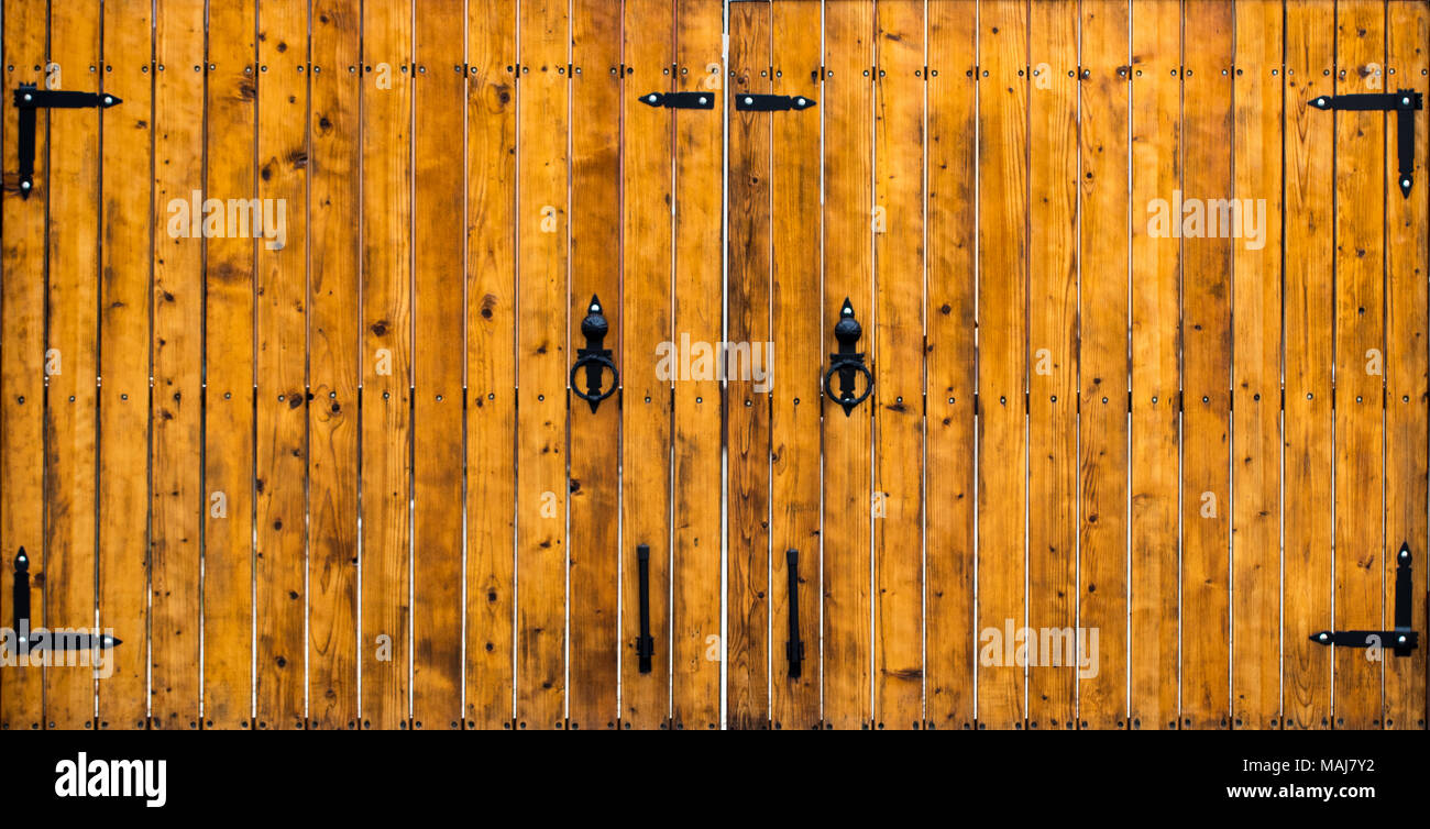 wooden gate with wrought iron elements close up Stock Photo - Alamy