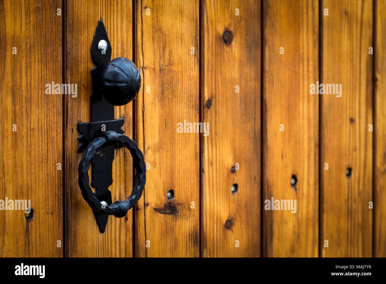 wooden gate with wrought iron elements close up Stock Photo - Alamy