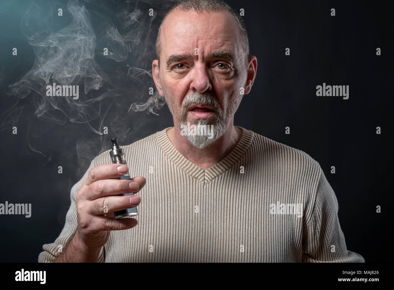 Old man vaping hi-res stock photography and images - Alamy