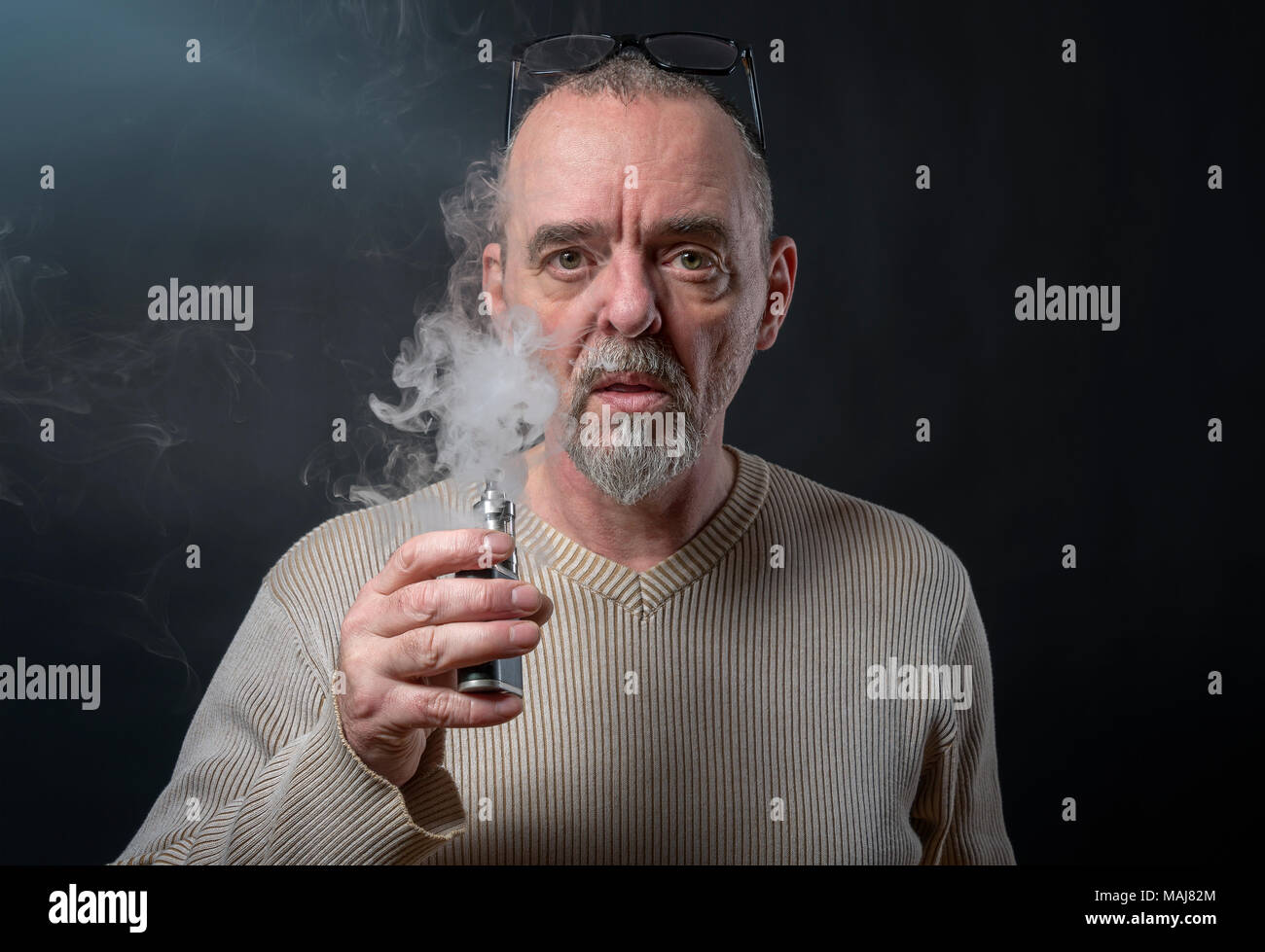 Old man vaping hi-res stock photography and images - Alamy