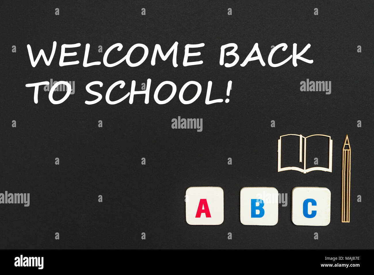 english colored square letters scattered on black background with text ...