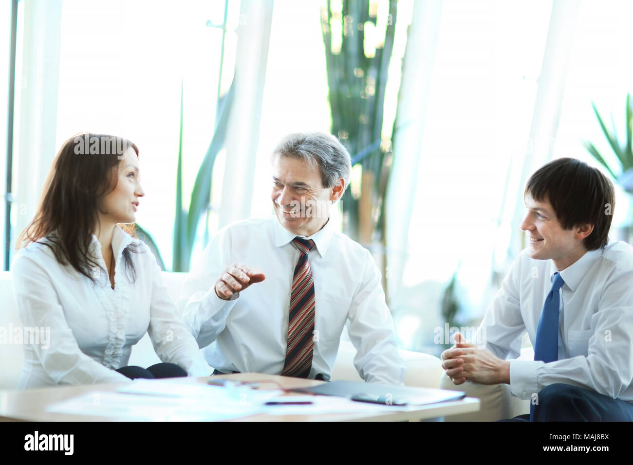 A serious meeting of business men at the office. Discussion team in the ...