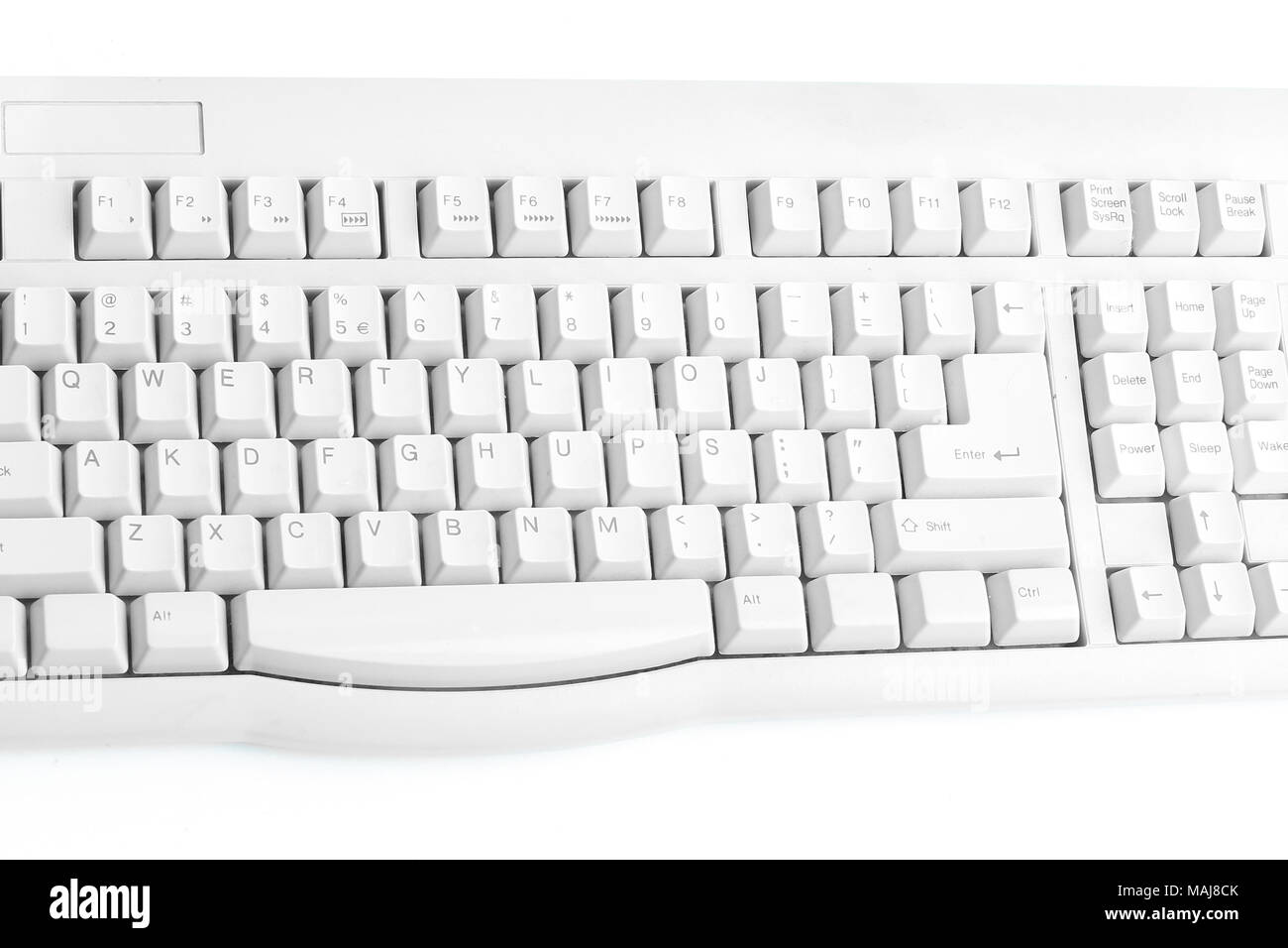 Old white keyboard on white background closeup Stock Photo - Alamy