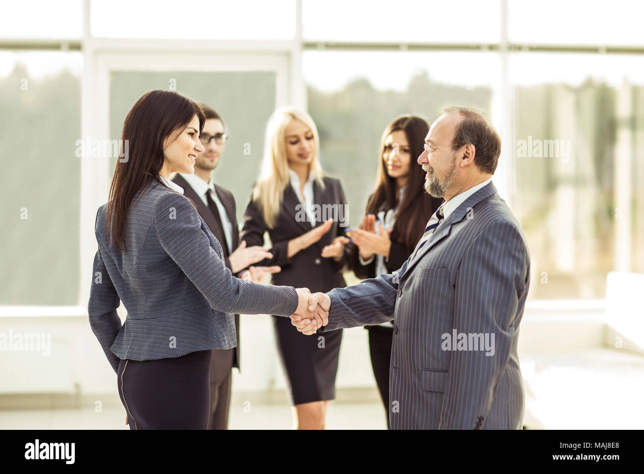 handshake of business partners after signing the contract Stock Photo ...