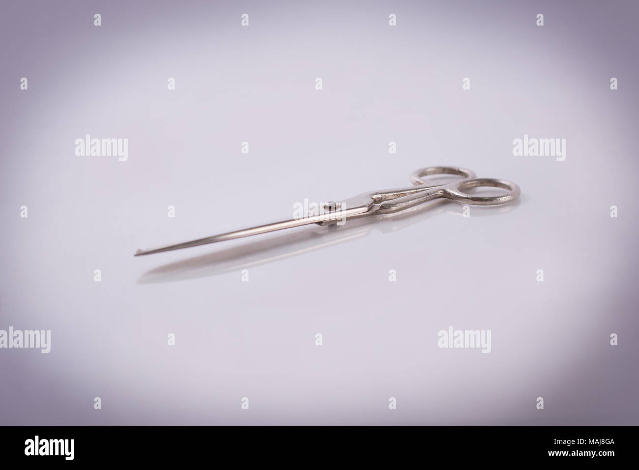 scissors made of metal.isolated on a light background Stock Photo - Alamy