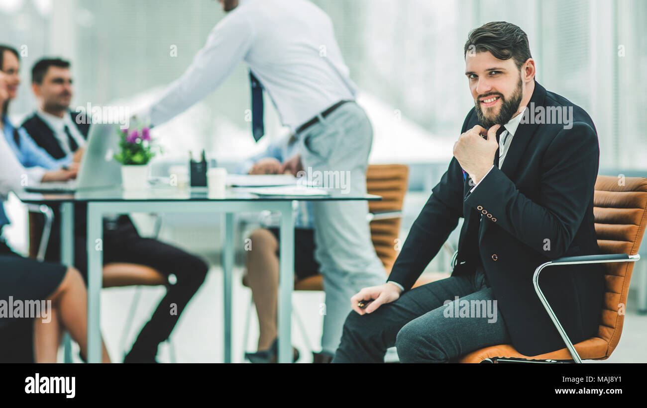 portrait of Manager on the background of business team working i Stock ...