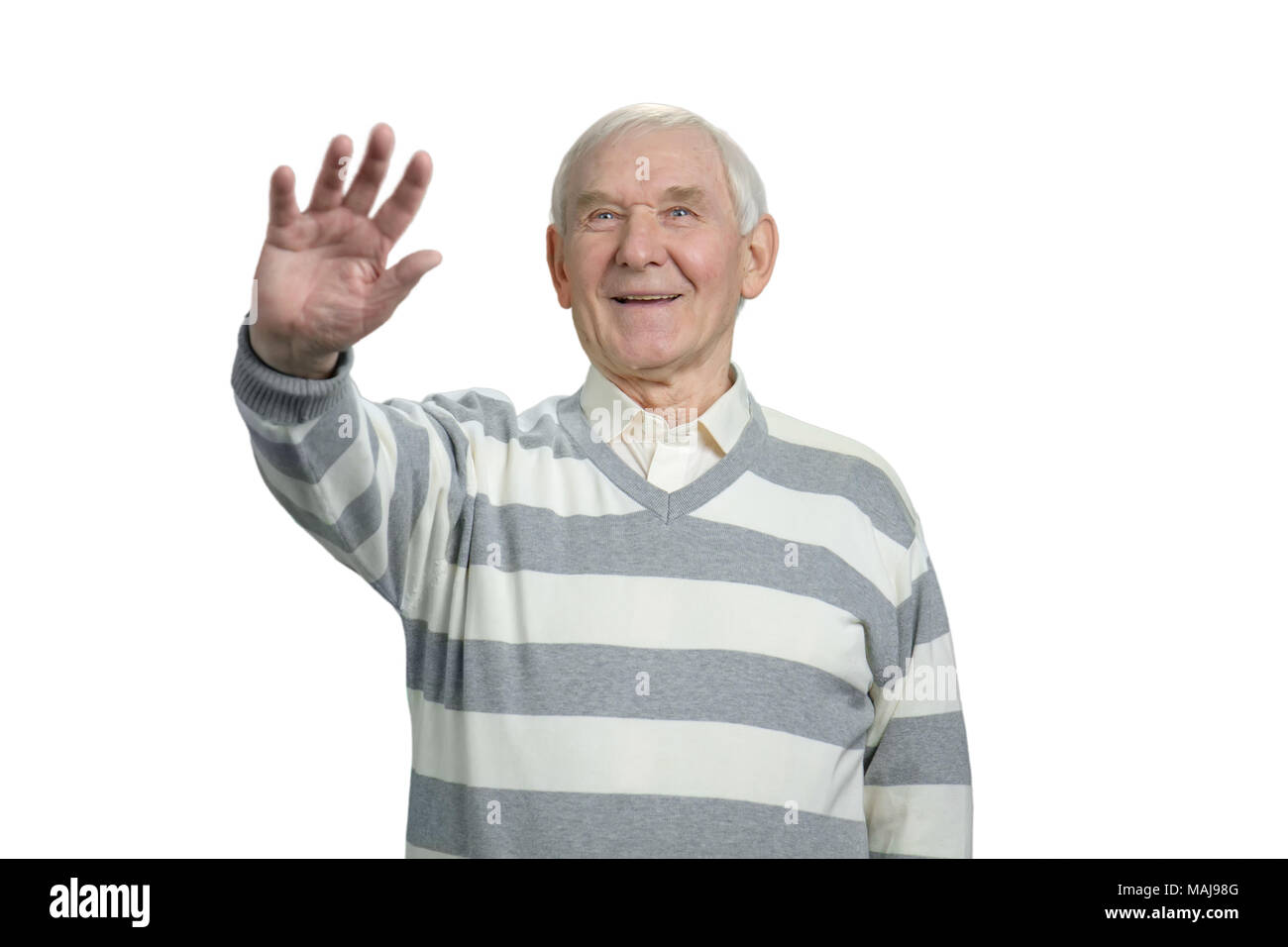 Old man greeting. Portrait of senior grandfather hailing with hand in ...