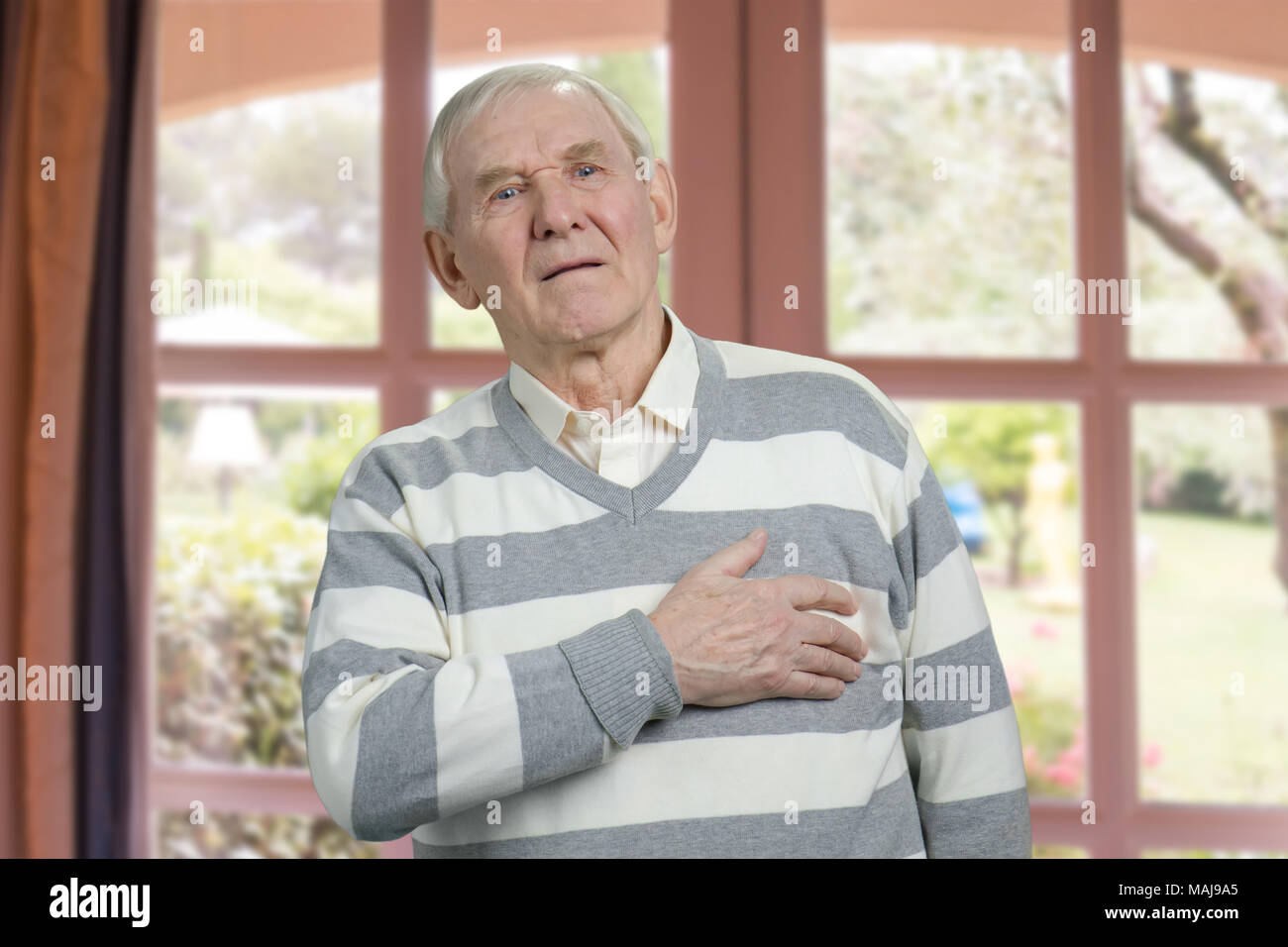 Old man having chest pain. Severe heartache, man suffering from heart ...