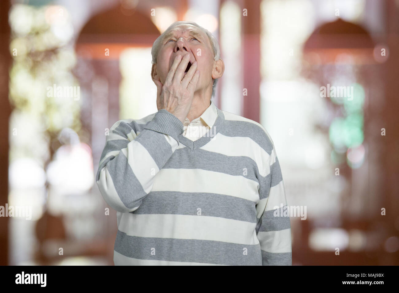 Portrait of yawning senior. Caucasian old man is yawning, abstract ...