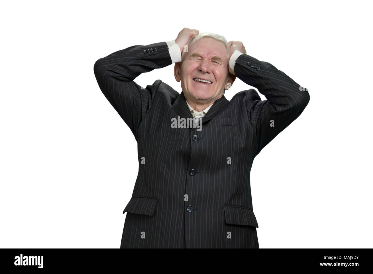 Old man holding his head with frustration. Upset senior businessman ...
