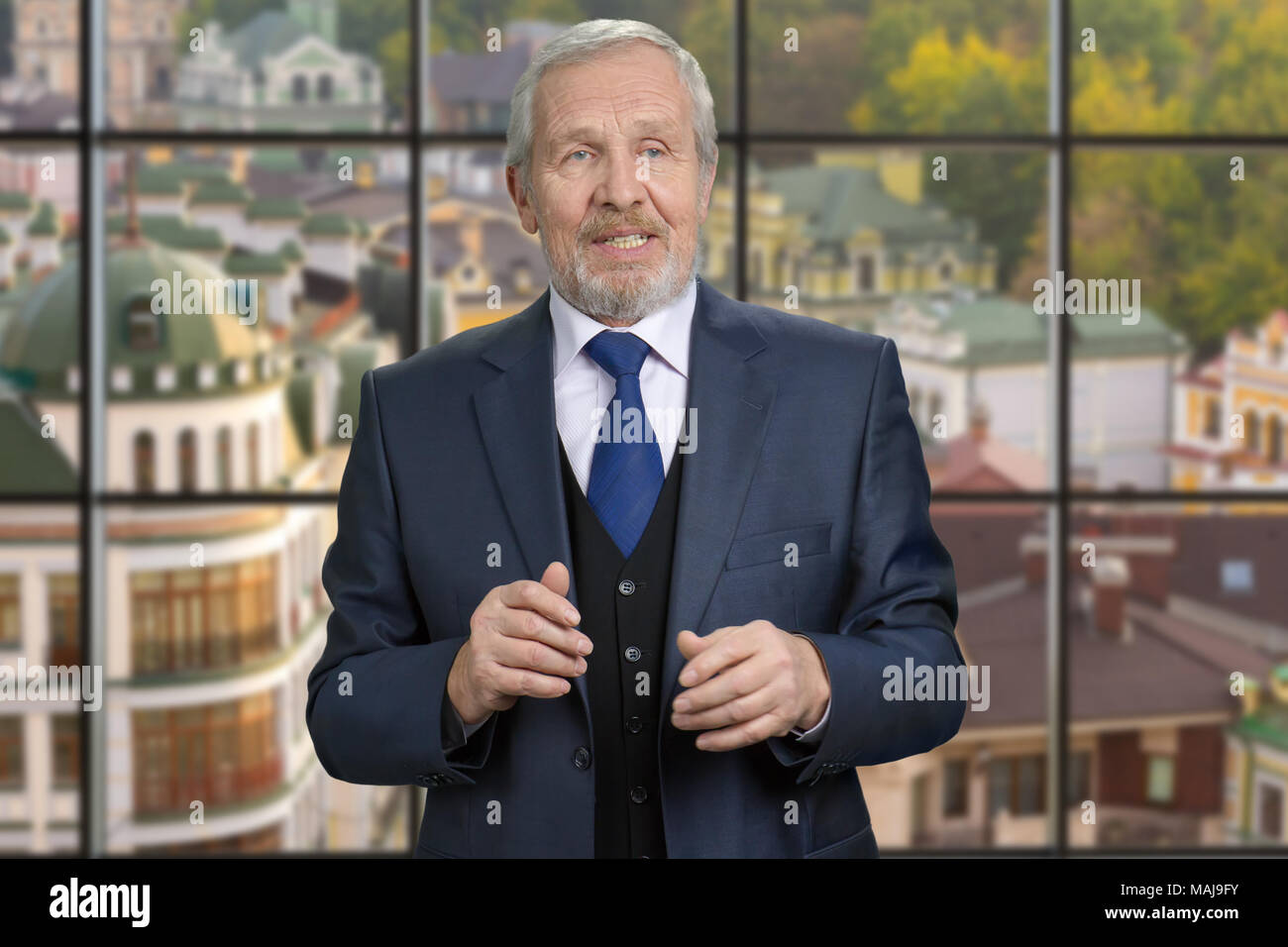 Old european politician man portrait. Senior man in suit talking ...
